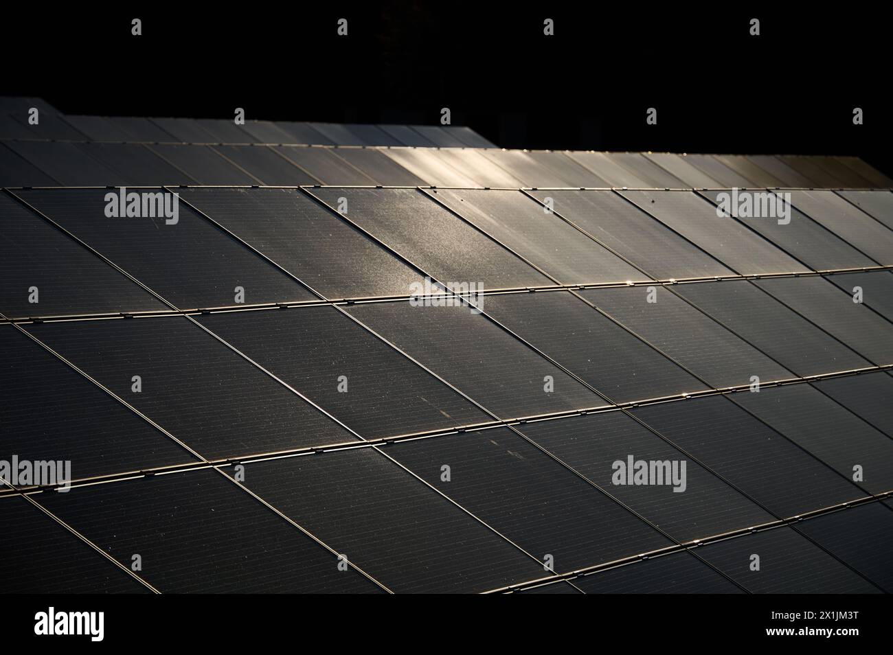 Solar panels in the sun's rays producing electricity Stock Photo - Alamy