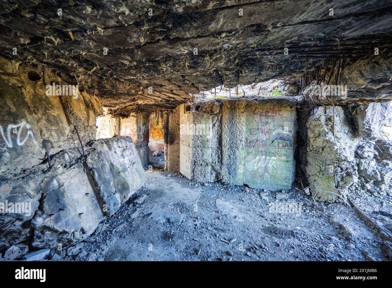 Inside the destroyed bunker from Second War World. Cracked reinforced ...