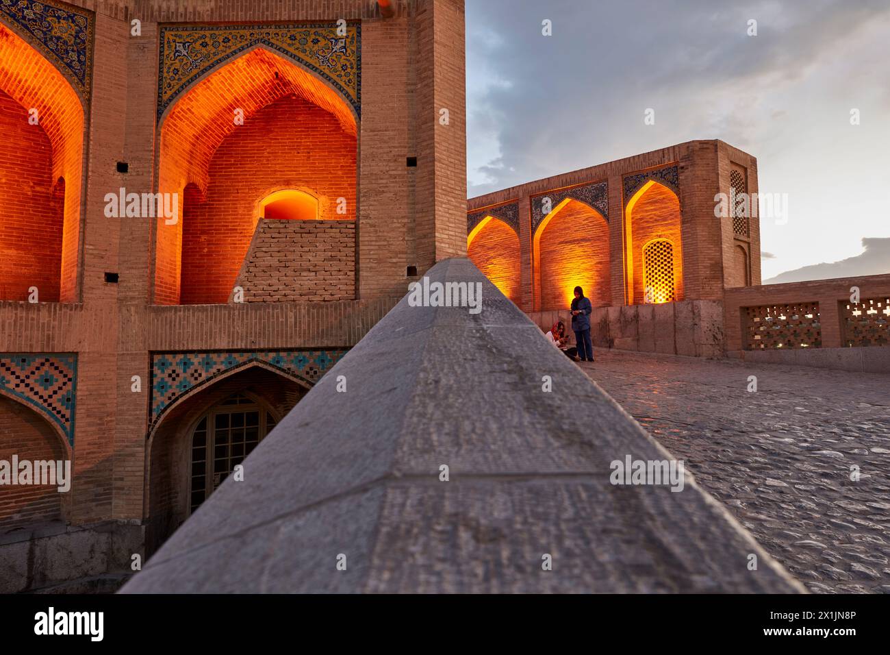 View of illuminated vaulted arches of the 17th century Khaju Bridge on ...