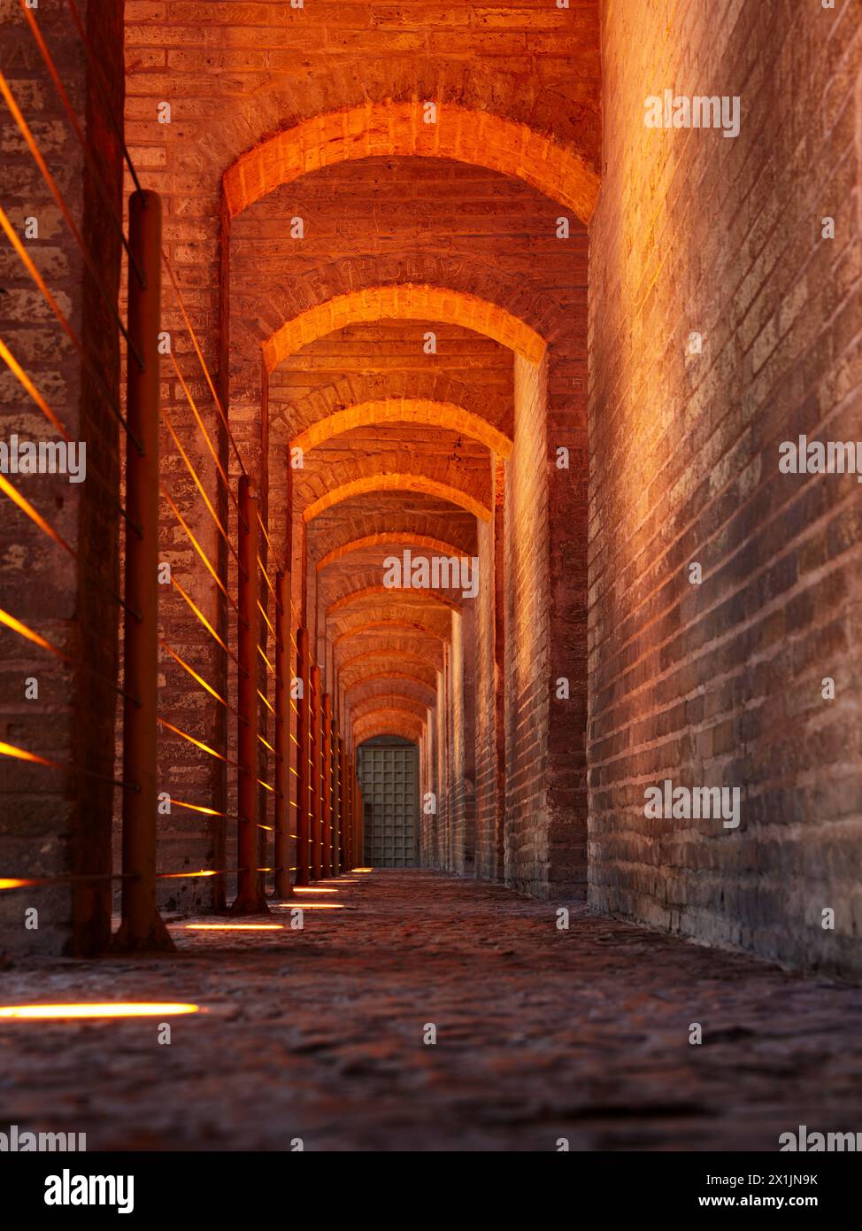 A low angle view through illuminated vaulted arches of the 17th century ...