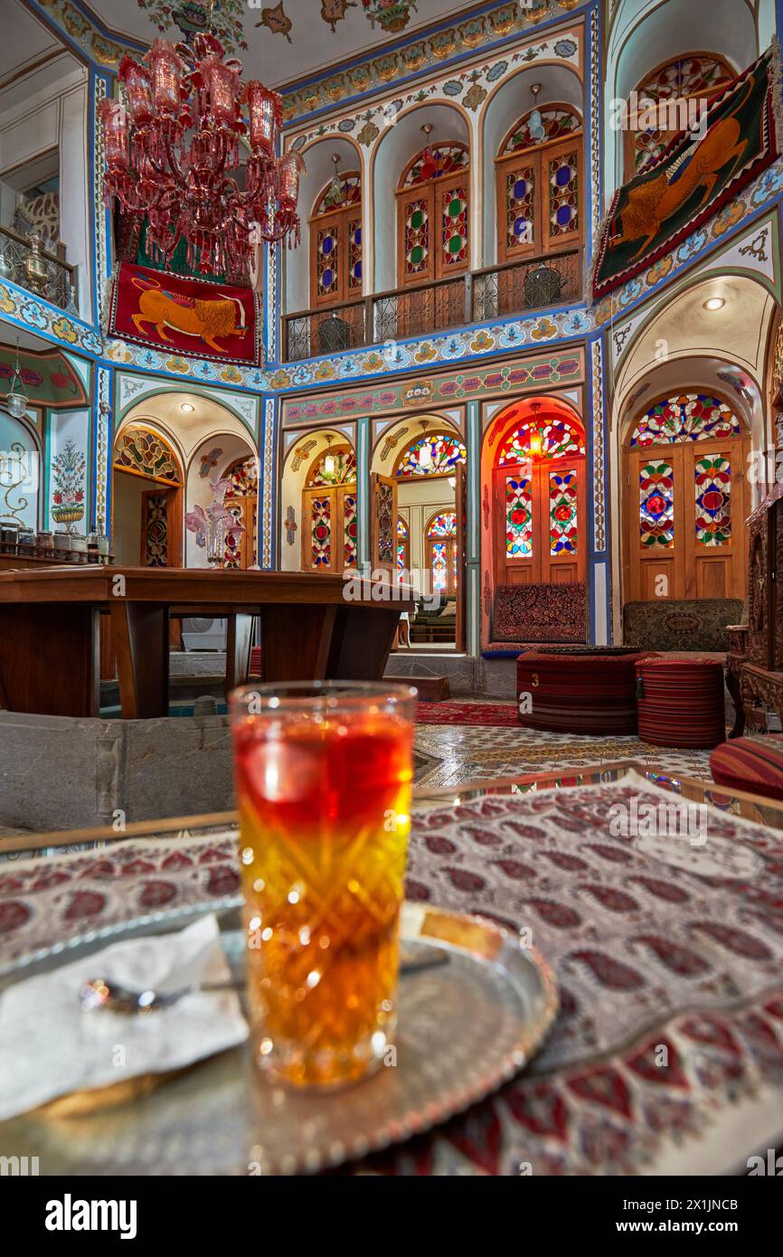 Ornate interior of a small cafe with stained glass windows in the ...