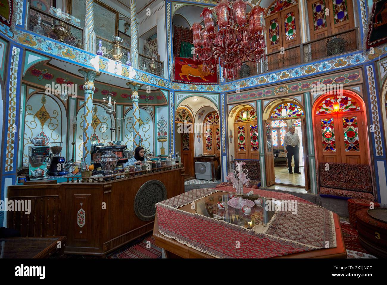 Ornate interior of a small cafe with stained glass windows in the ...