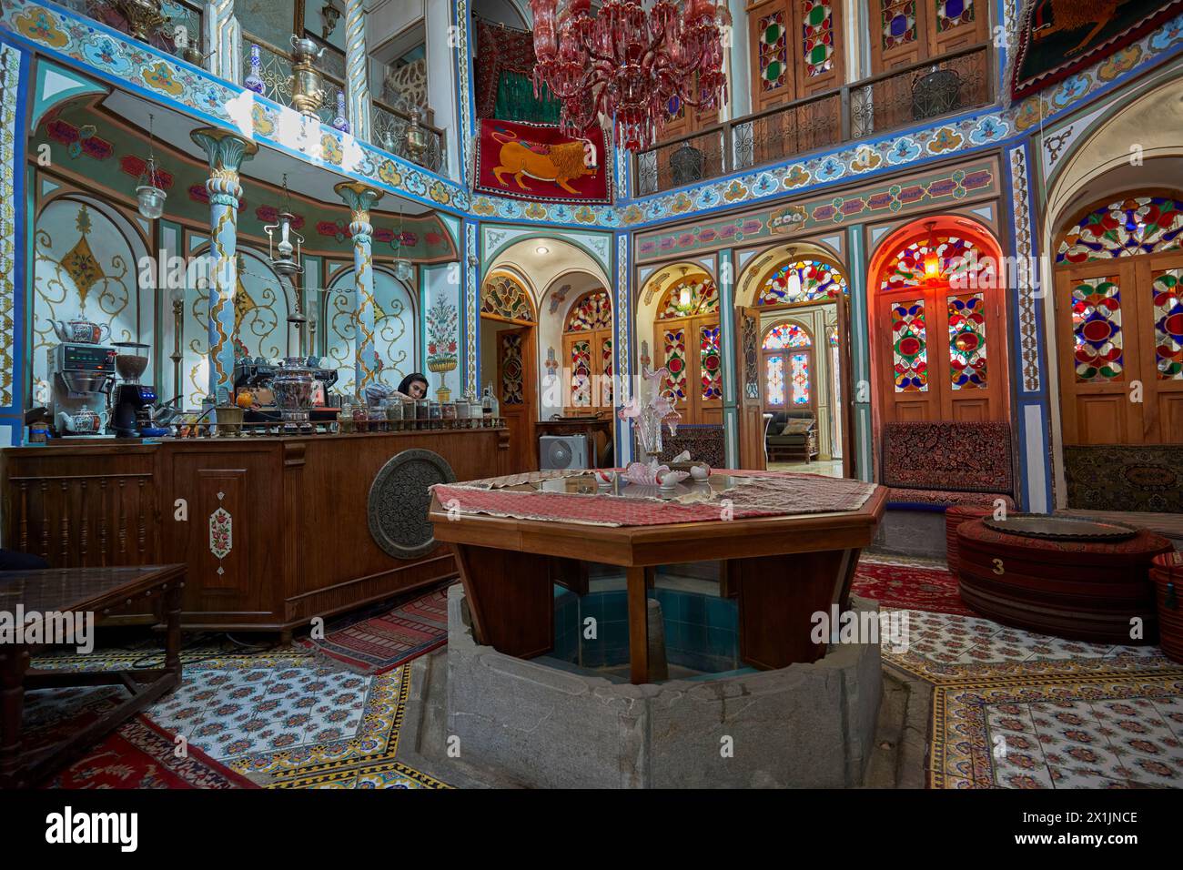 Ornate interior of a small cafe with stained glass windows in the ...