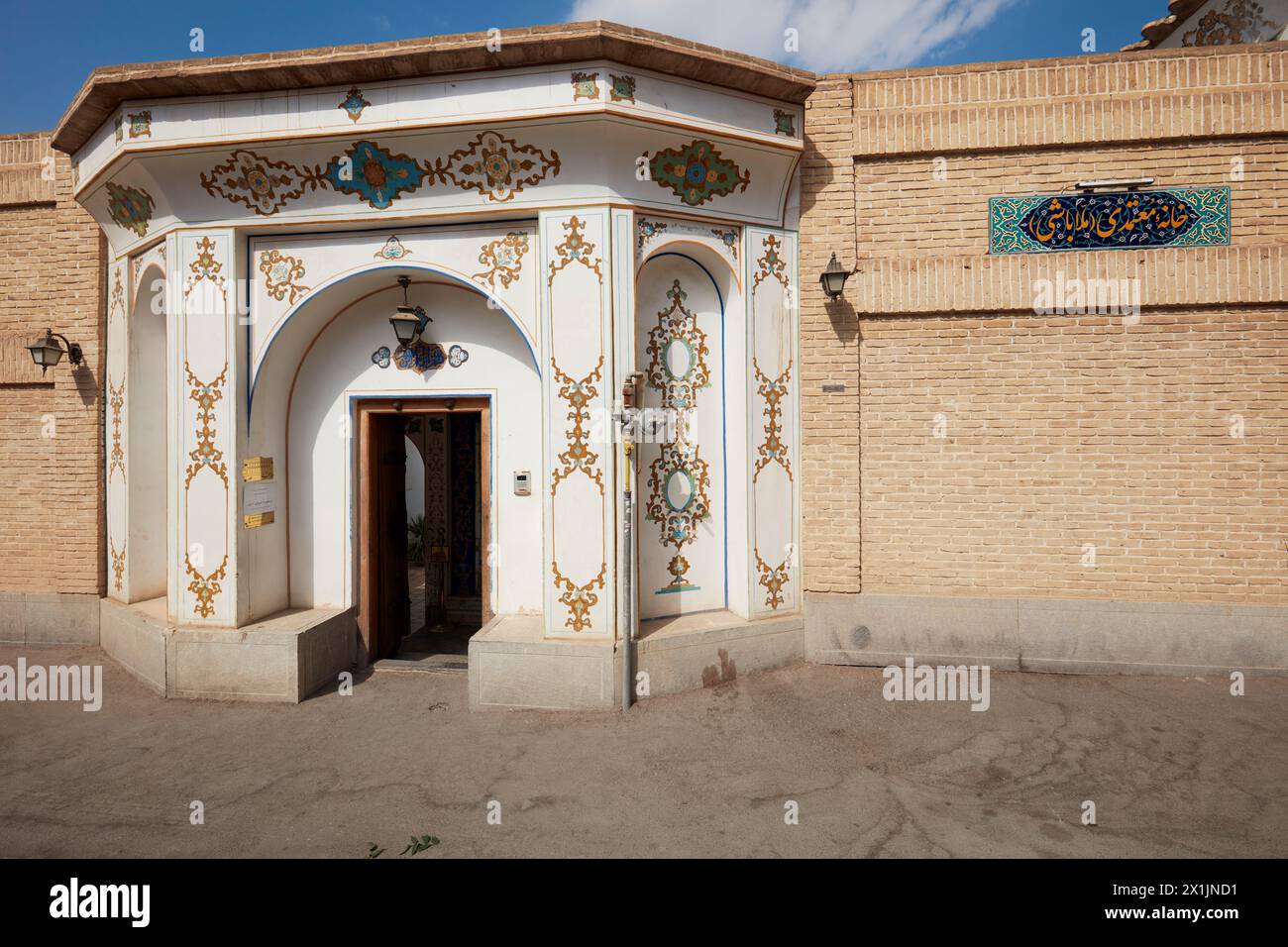Ornate entrance gate of the Mollabashi Historical House in Isfahan ...