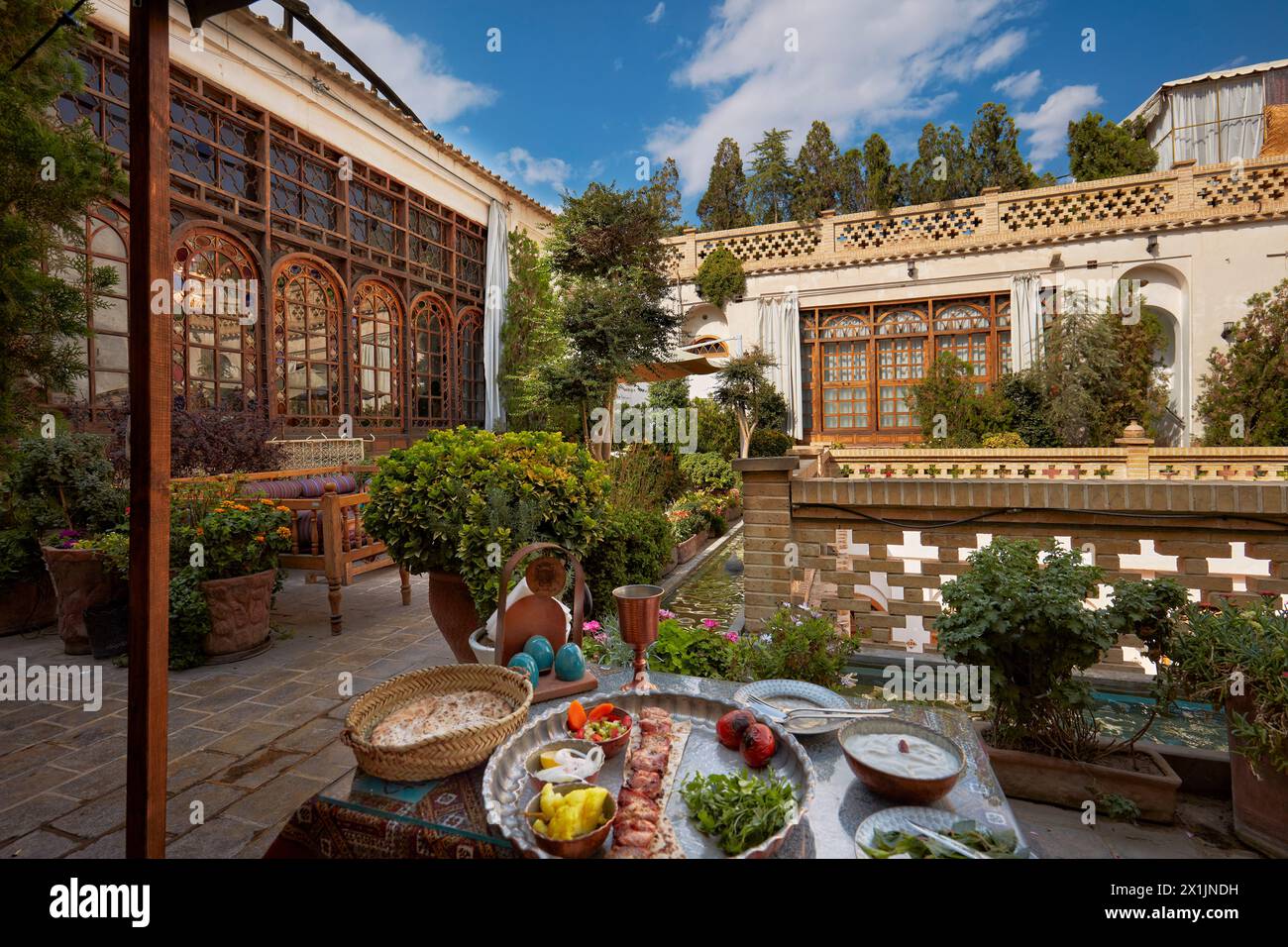 Chicken kebab with vegetables and flat bread served in a traditional ...