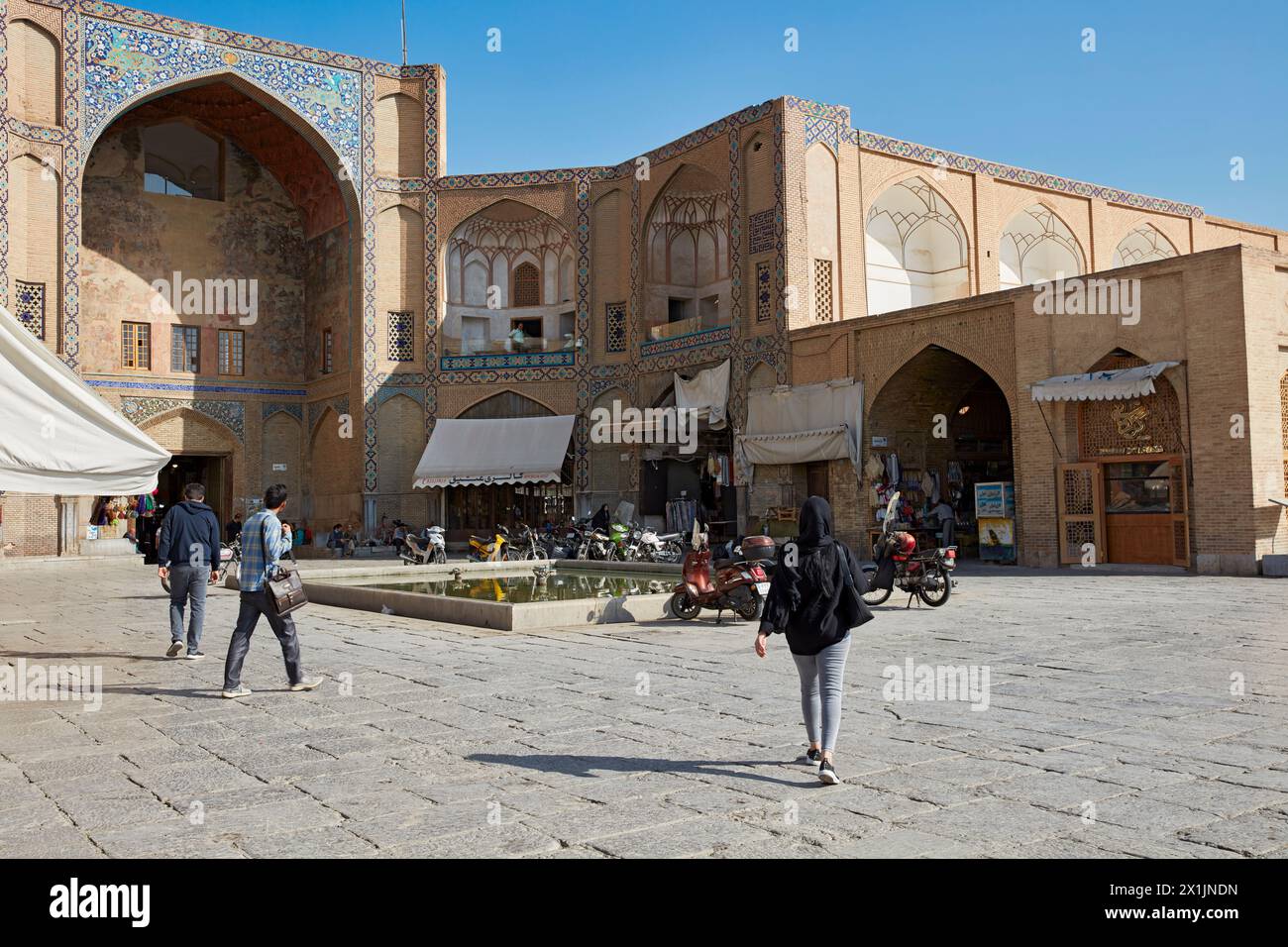 People walk at the Qeysarie Gate, the main gateway to the Grand Bazaar ...