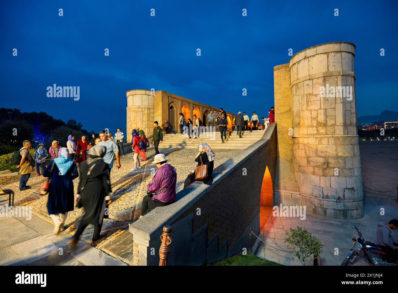 People walk across the Allahverdi Khan Bridge, aka Si-o-se-pol (17th ...