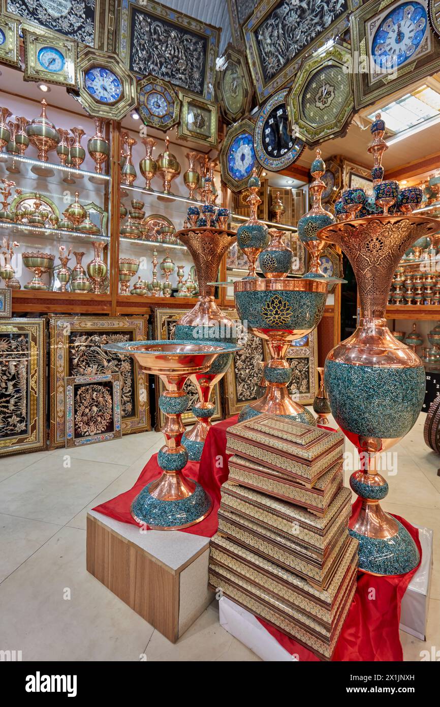 Handmade copper vases inlaid with Persian turquoise displayed in a ...
