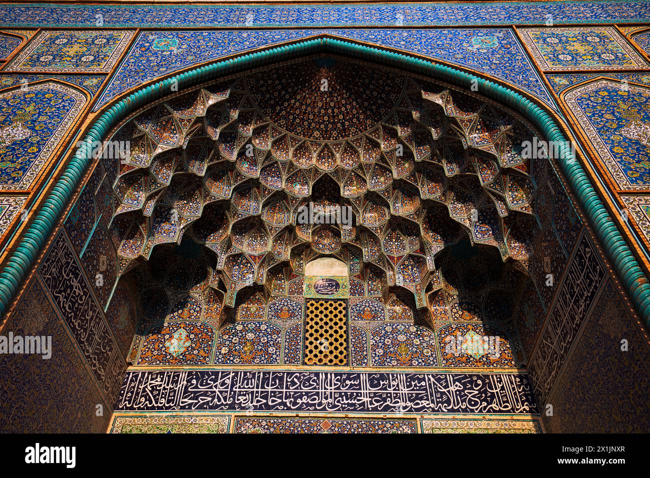Ceiling with muqarnas vaulting covered with tiles in the iwan entrance ...