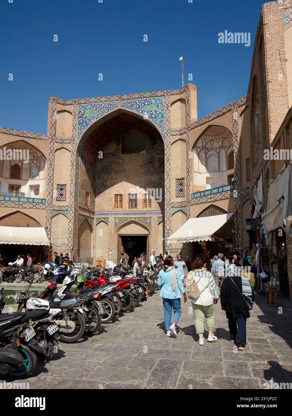 People walk at the Qeysarie Gate, the main gateway to the Grand Bazaar ...