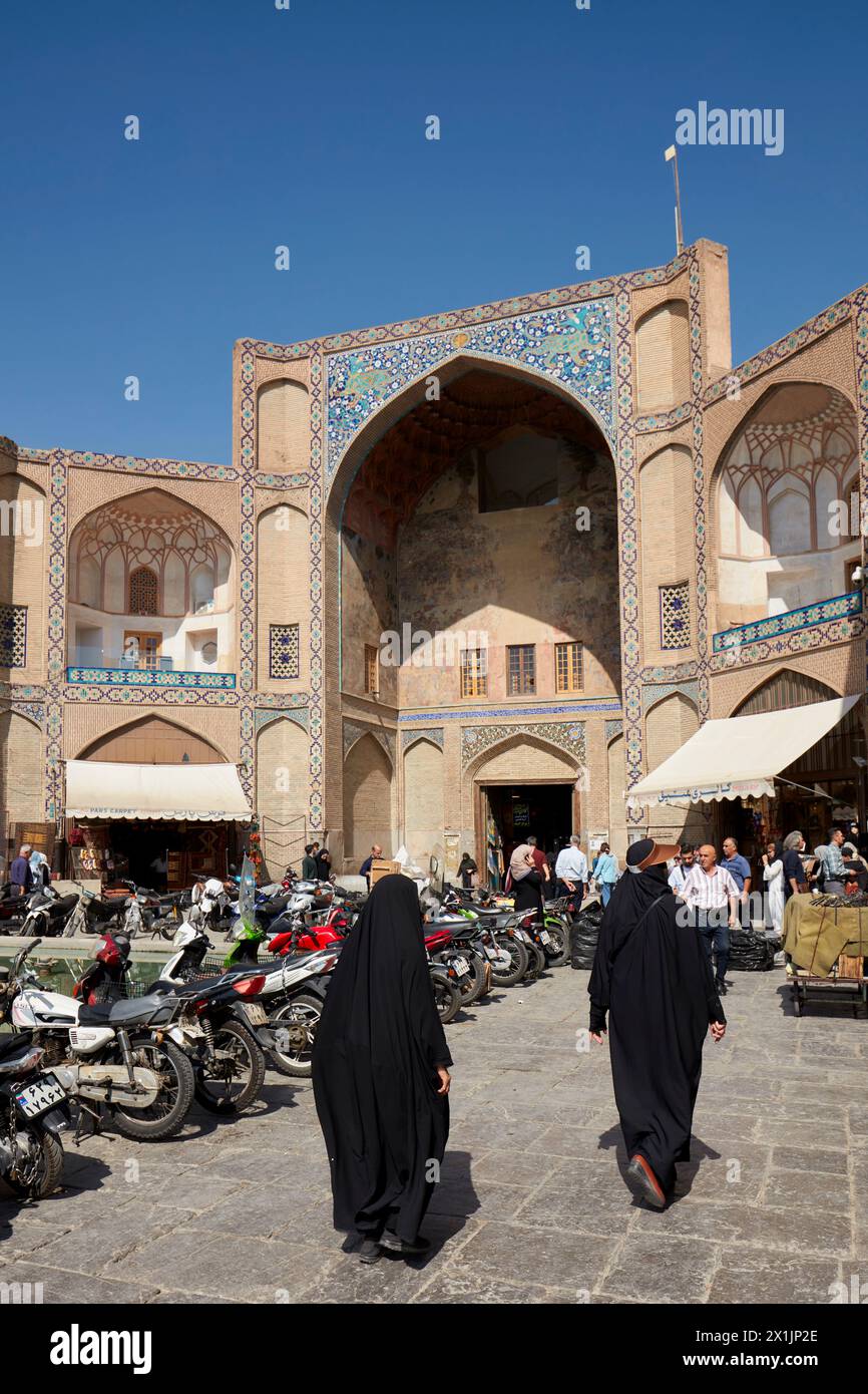 People walk at the Qeysarie Gate, the main gateway to the Grand Bazaar ...