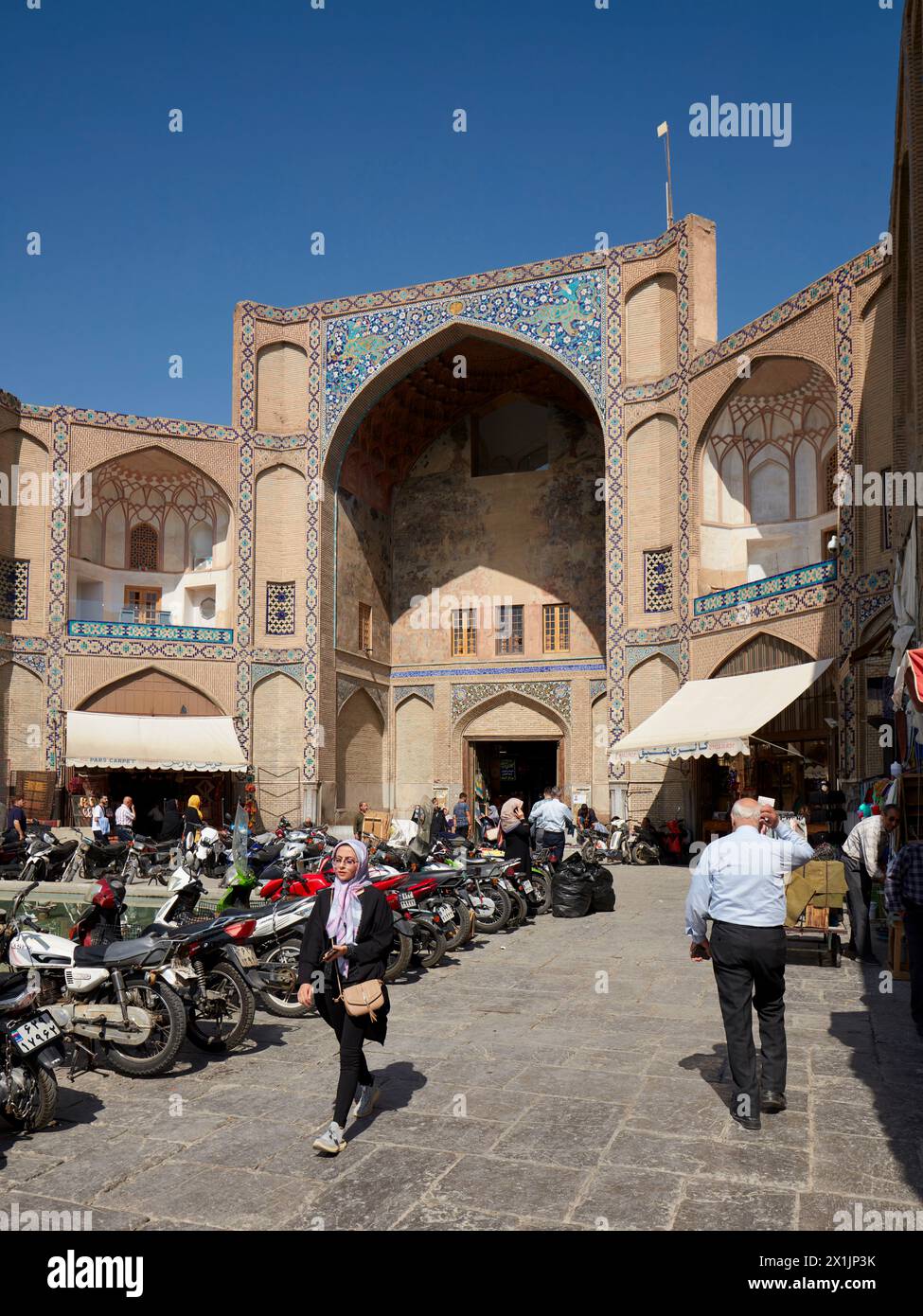 People walk at the Qeysarie Gate, the main gateway to the Grand Bazaar ...
