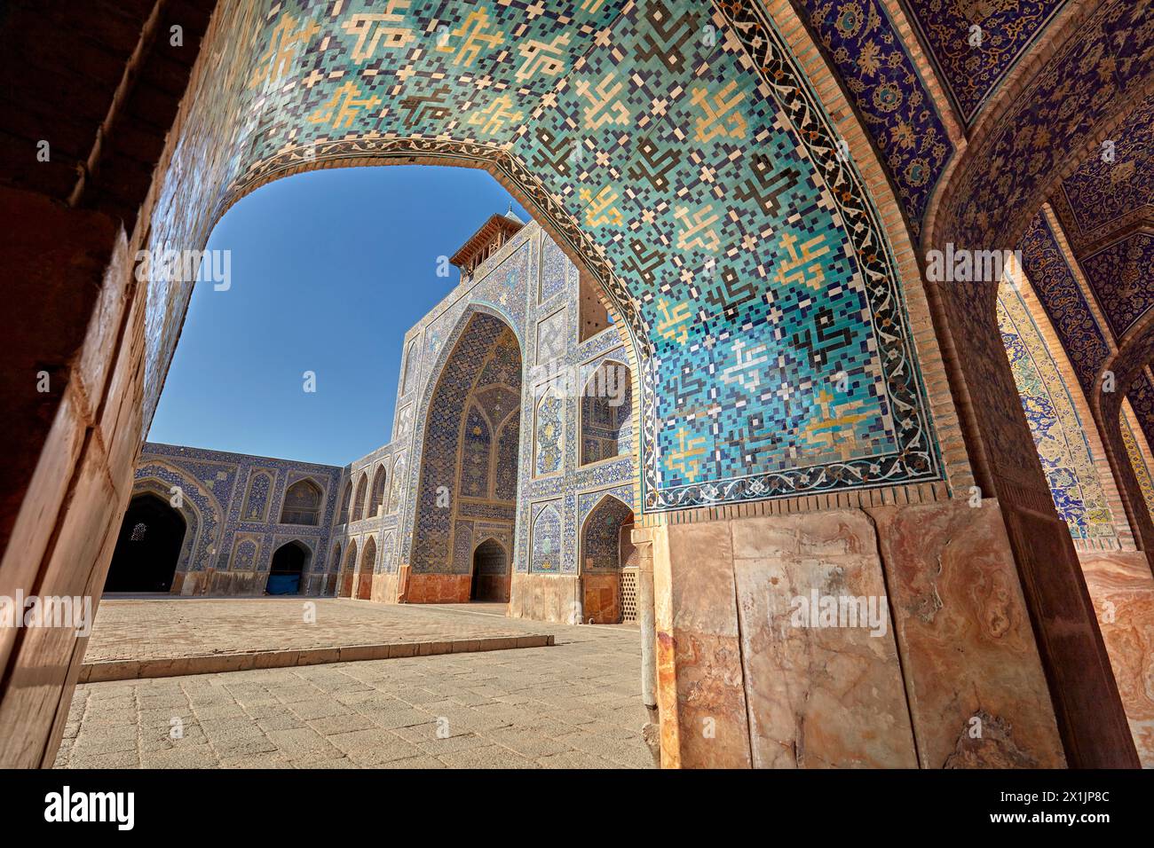 Courtyard view of the Shah Mosque (Masjed-e Shah) through an arch with ...