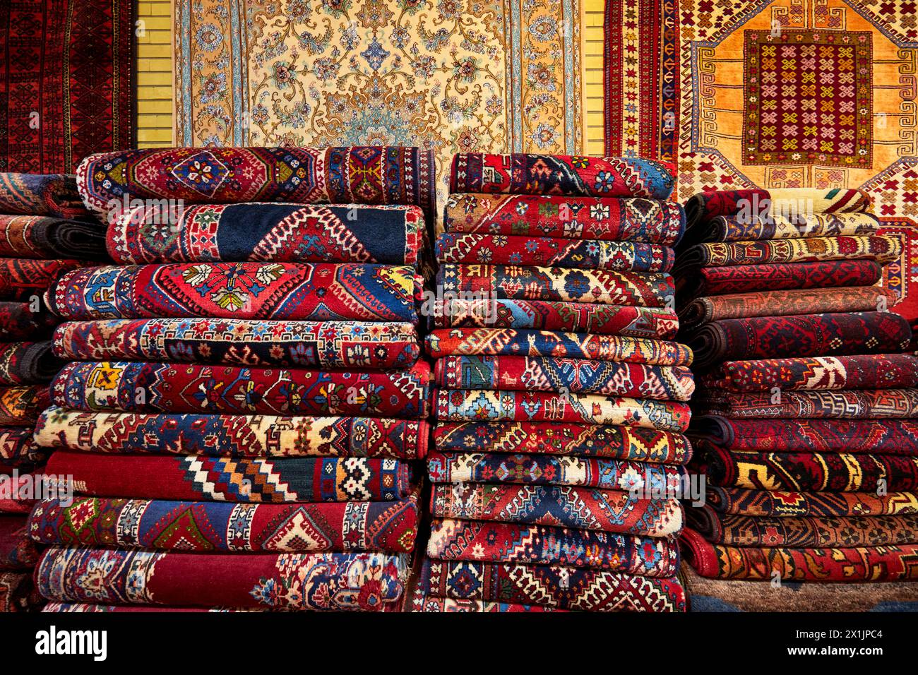 Colorful selection of handmade Persian carpets displayed in a carpet ...