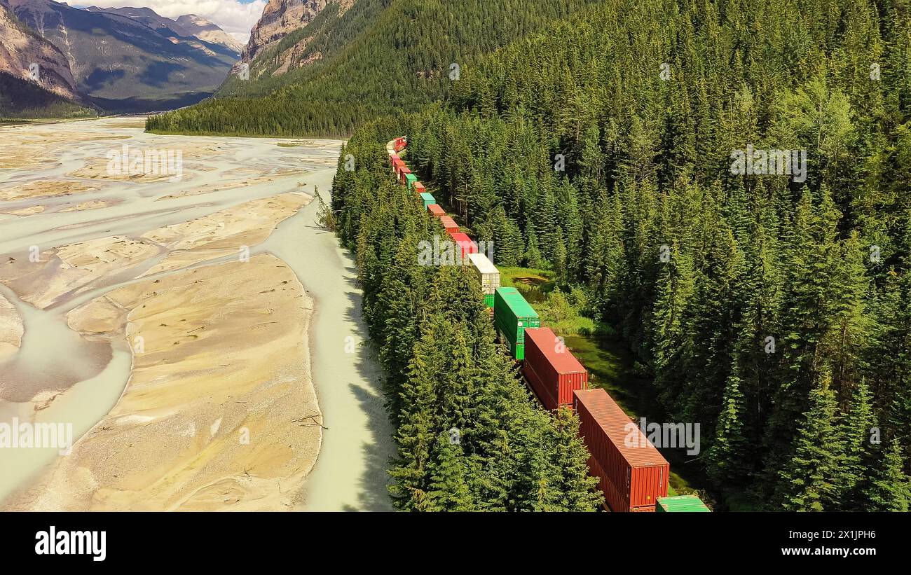 Train passes along river. Mountain river flowing through forest during ...