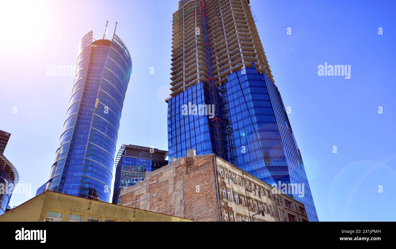 High rise building under construction. Installation of glass facade ...