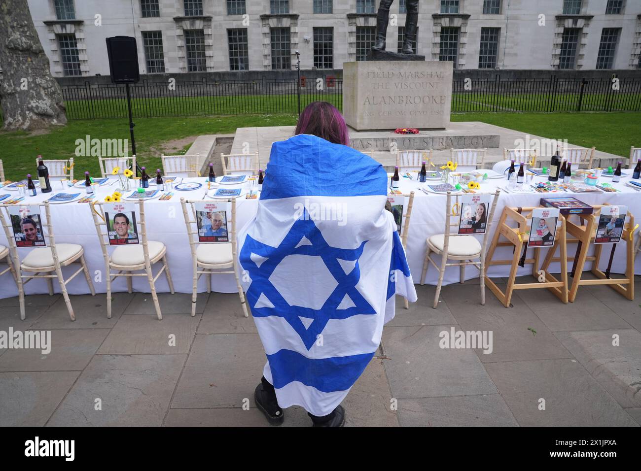 Organisers set up the Empty Seder Table installation, an empty dining ...