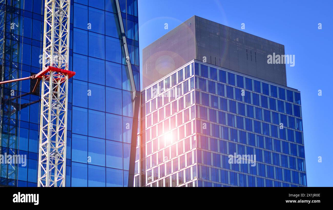 High rise building under construction. Installation of glass facade ...