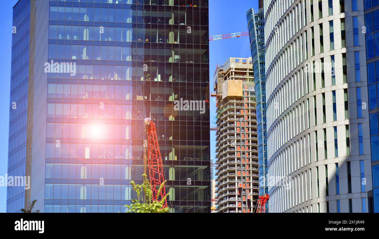 High rise building under construction. Installation of glass facade ...