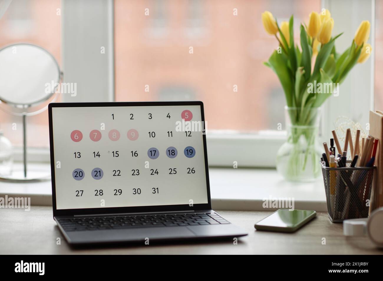 Background image of laptop computer with calendar on screen at ...