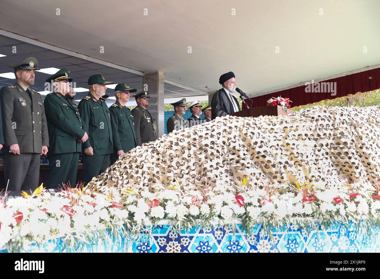 Iranian President Ebrahim Raisi speaks during a parade marking National ...