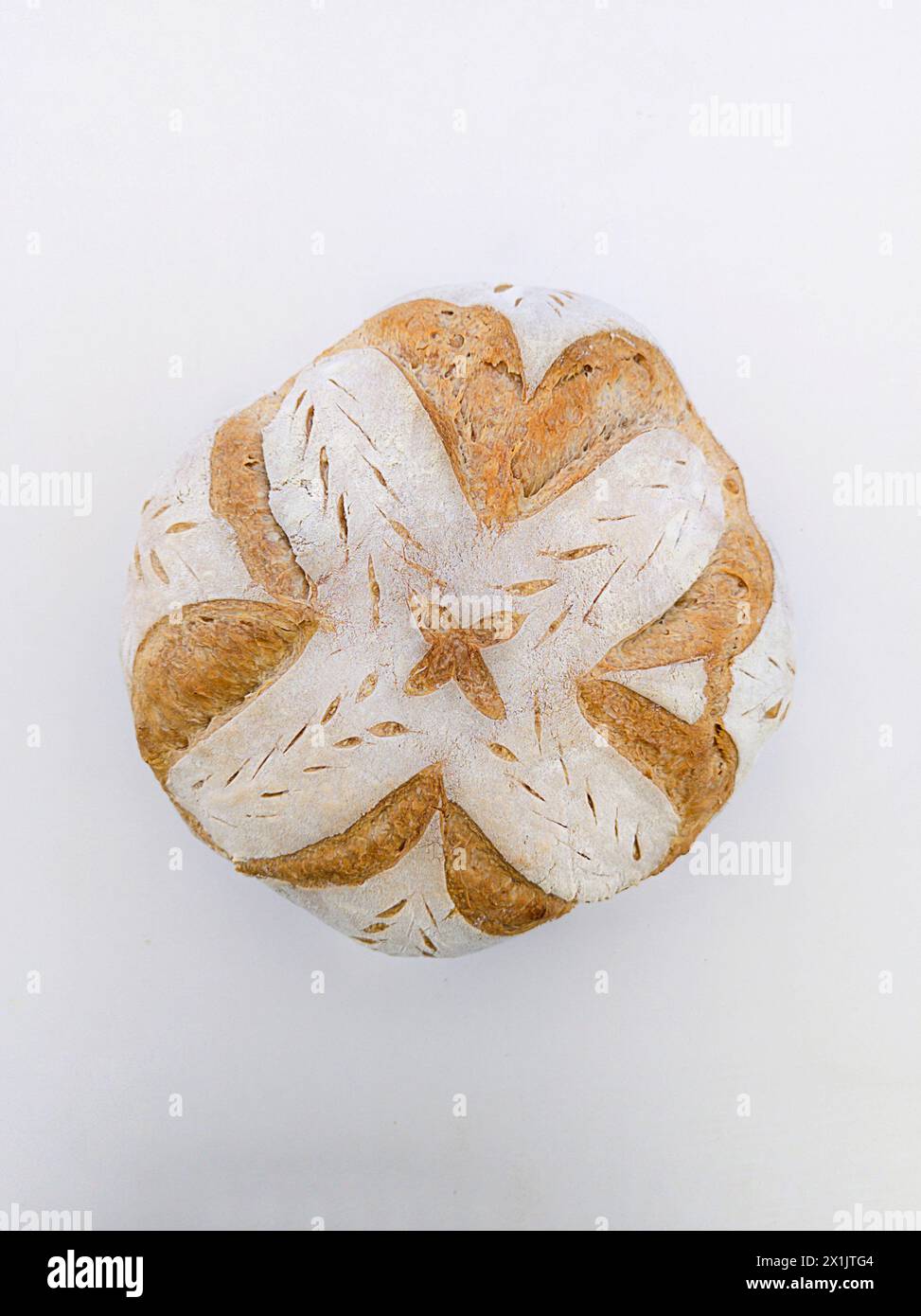 Handmade sourdough bread with symmetrical drawing. Horizontal shot with ...