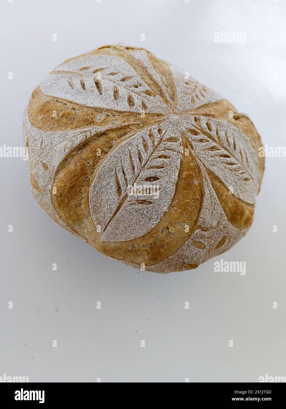 Handmade sourdough bread with symmetrical drawing. Horizontal shot with ...