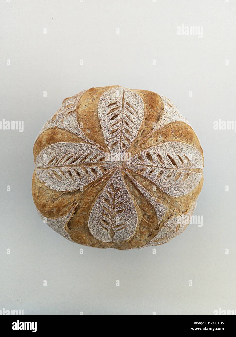 Handmade sourdough bread with symmetrical drawing. Horizontal shot with ...