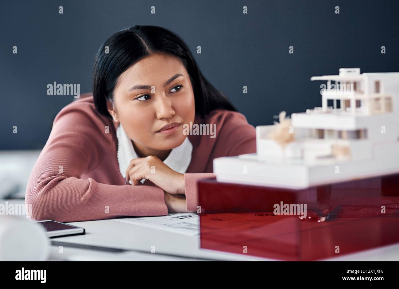 Woman, architect and thinking by model for project in office with ideas ...