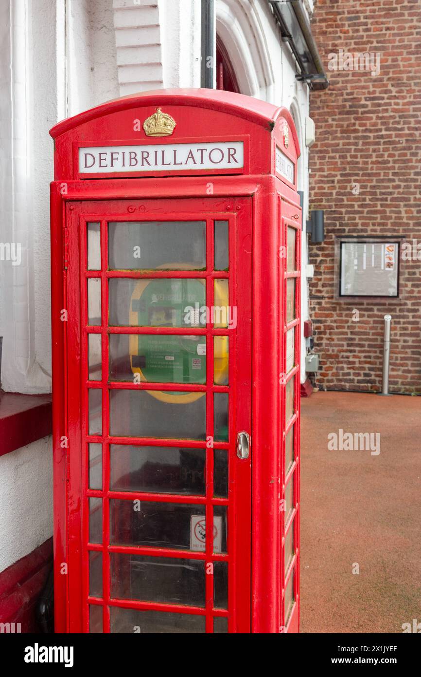 Old red telephone box converted into a defibrillator station Stock ...
