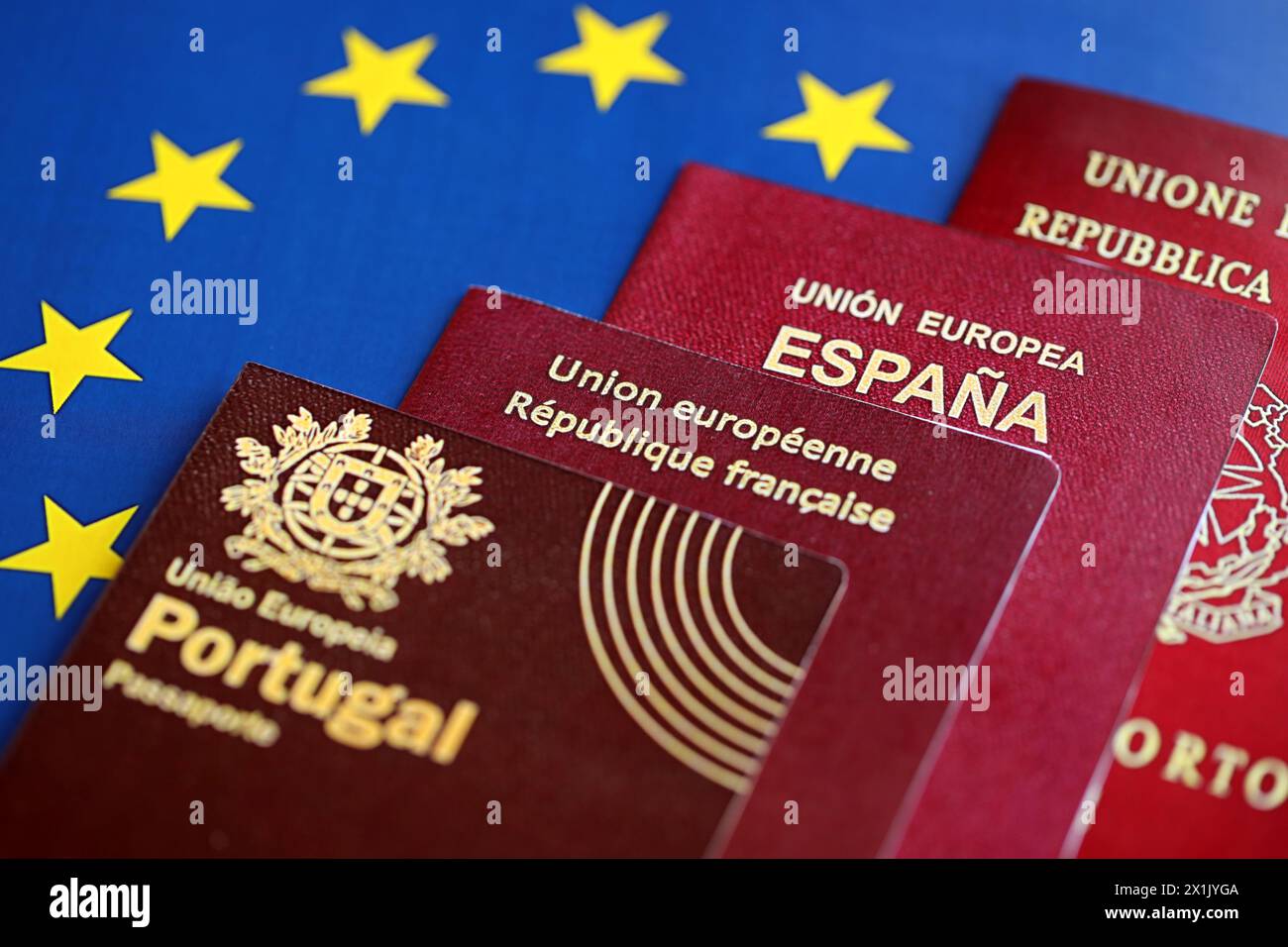 European union countries passports on blue EU flag close up. Portugal ...