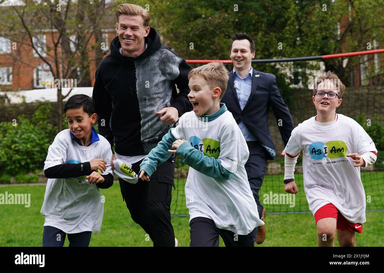 Footballer James McClean (second left) and Adam Harris (behind centre ...