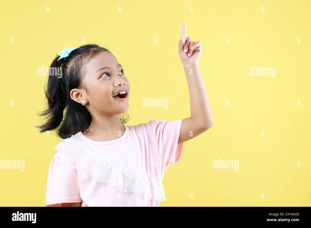 Asian Girl AHA Great Idea Concept on Yellow Background, Copy Space for ...