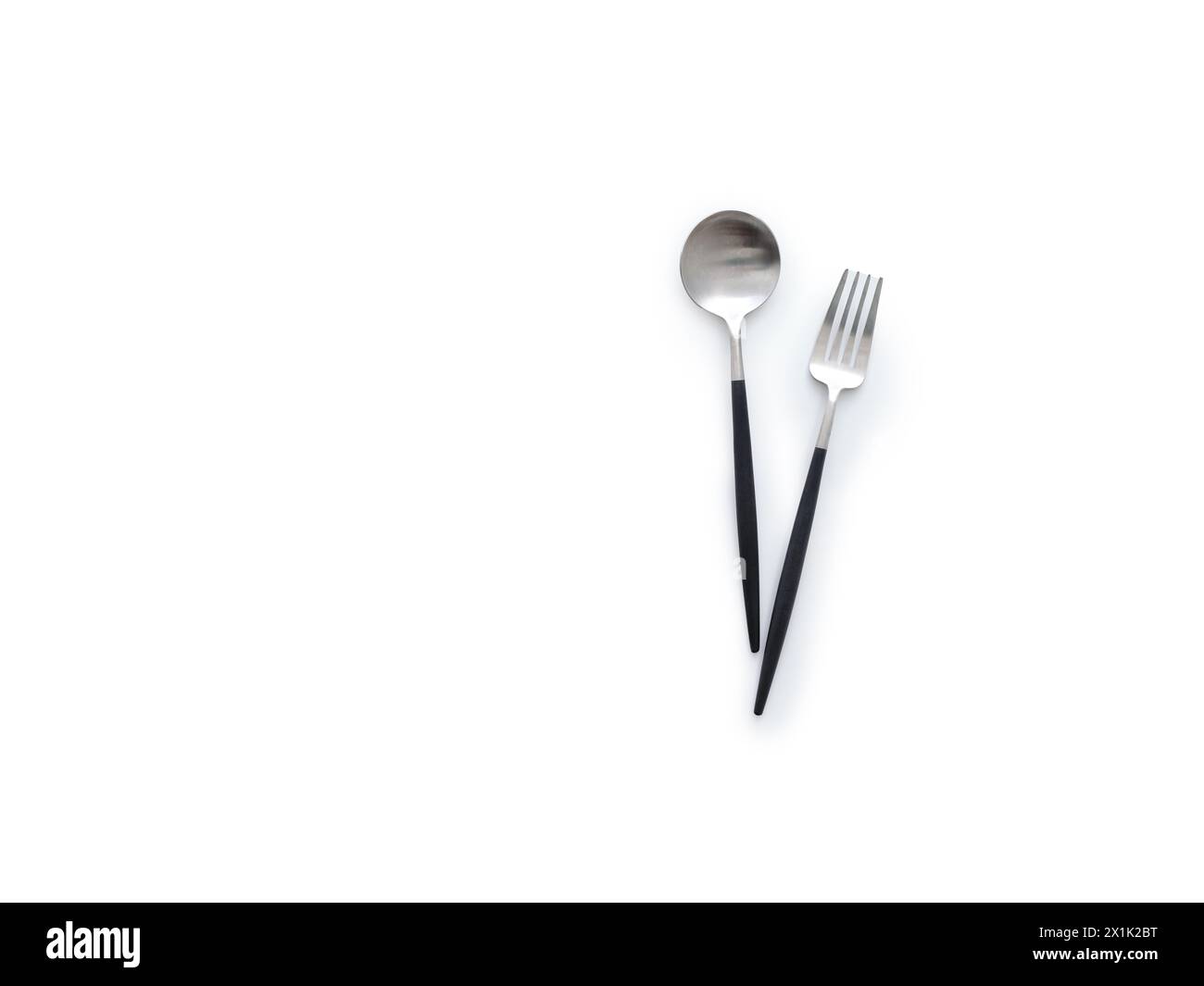 Flat lay cutlery on white background, fork and spoon isolated top view ...