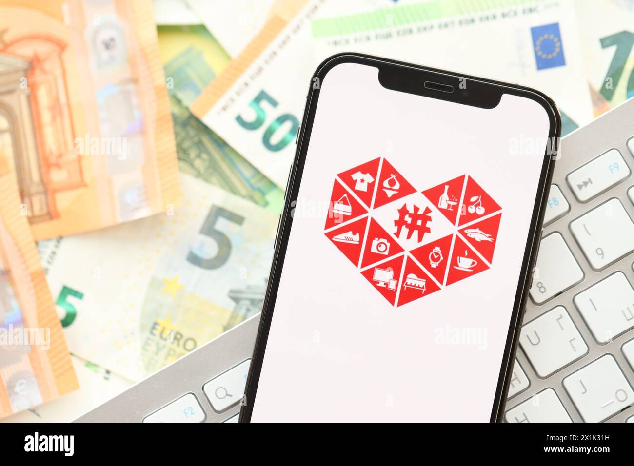 KYIV, UKRAINE - APRIL 1, 2024 Pinduoduo icon on smartphone screen on ...