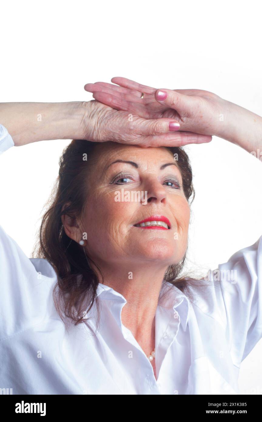 Studio shot of an expressive senior female cut out against a white ...