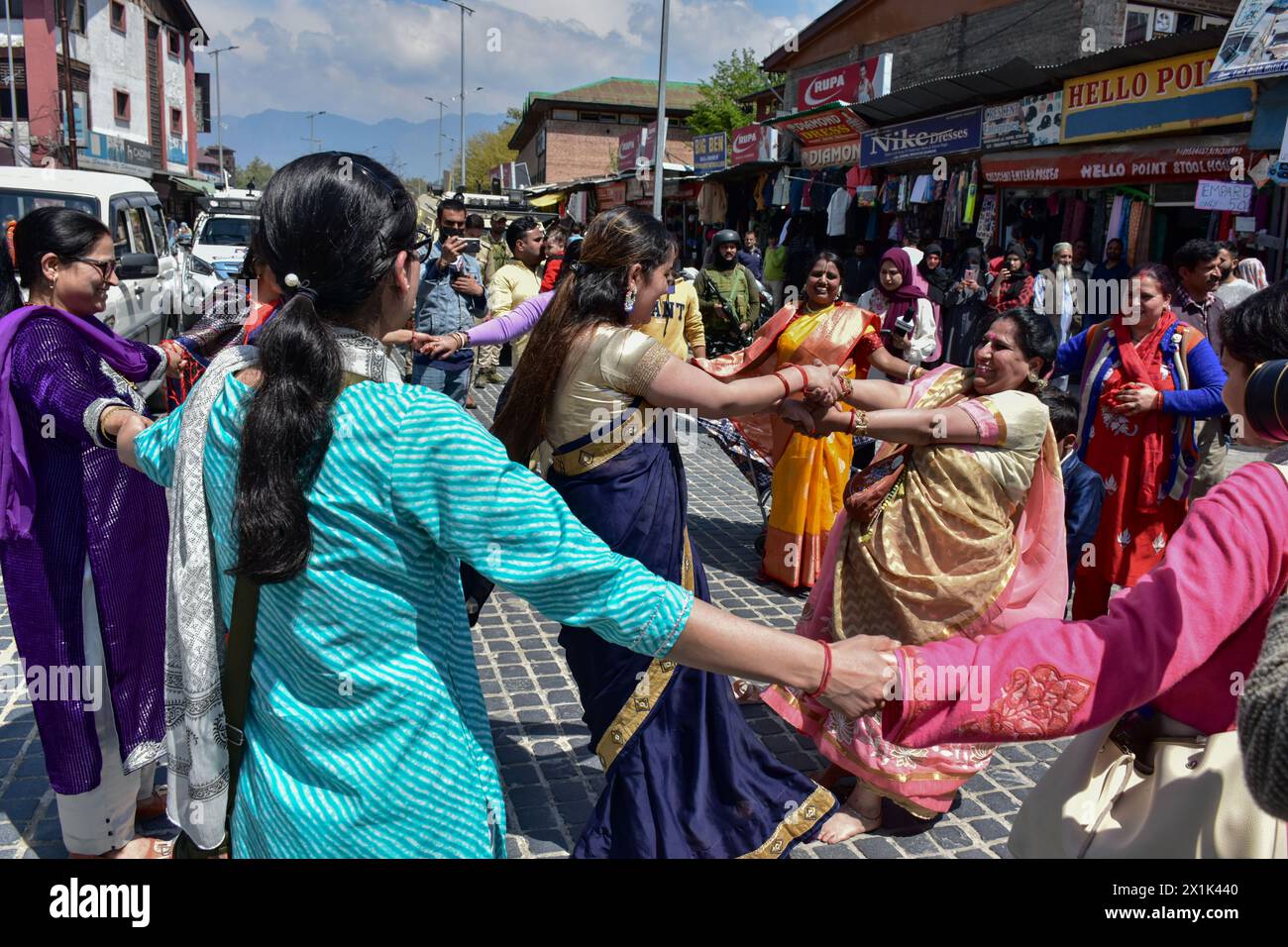 Hindu devotees perform rituals during a religious procession to ...