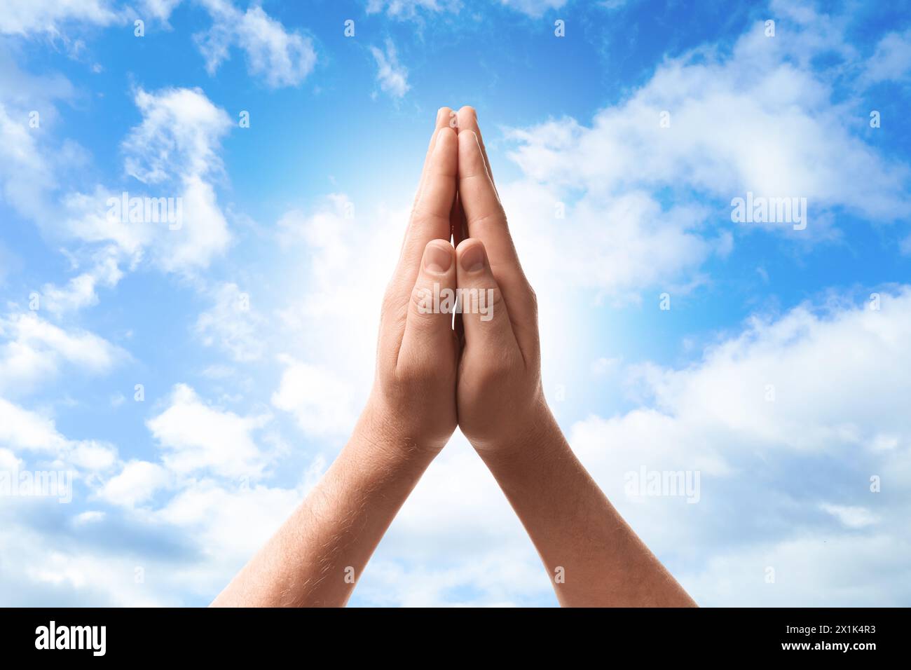 Religion. Christian man praying against sky, closeup Stock Photo - Alamy