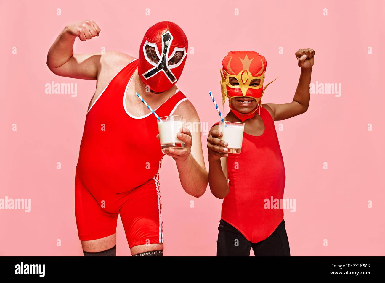 Two masked wrestlers in red, flexing muscles and holding milkshakes ...