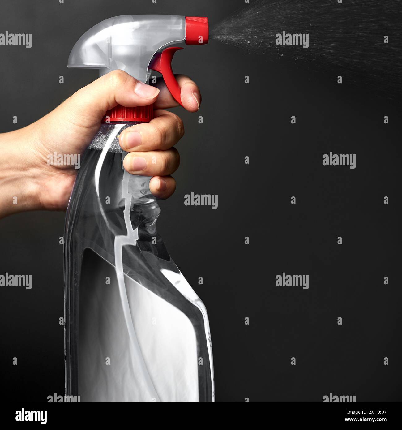 Hand, person or spray for cleaning studio on black background for ...