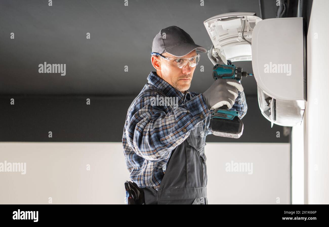 Professional HVAC Technician Performing Air Conditioning Splitter Unit ...