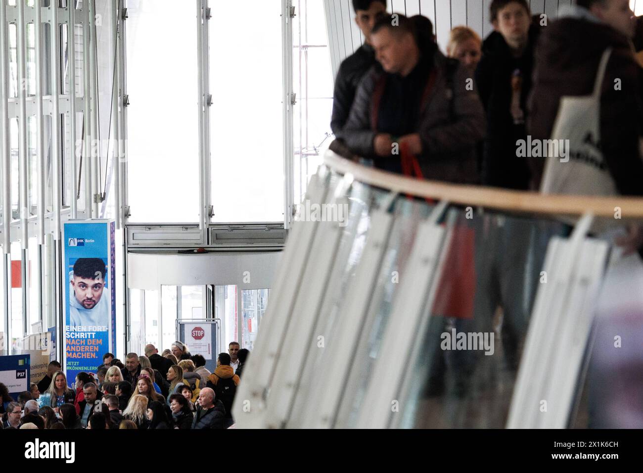 Berlin, Germany. 17th Apr, 2024. Visitors walk past stands with job ...