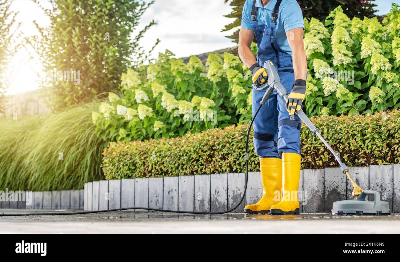 Residential Concrete Driveway Pressure Washing Using Powerful Washer ...