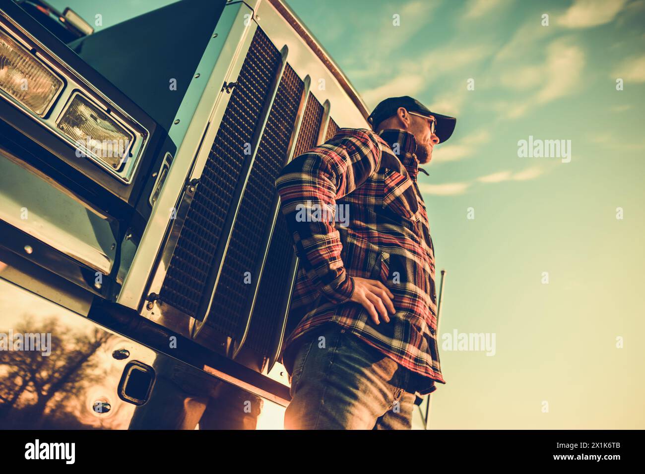 American Semi Truck Professional Driver in Front of His Vehicle ...
