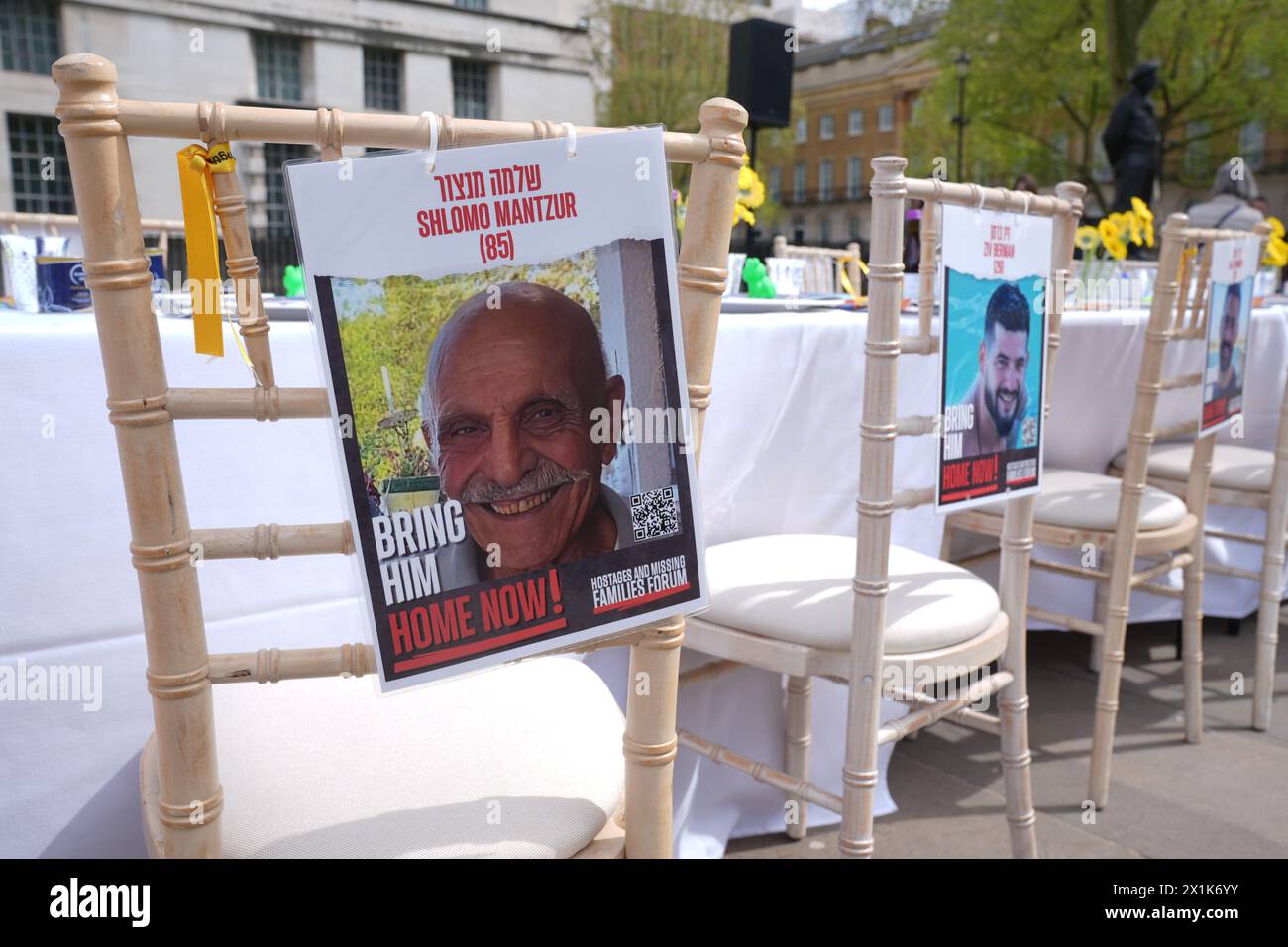 An image of Shlomo Matzur hangs from a chair at the Empty Seder Table ...