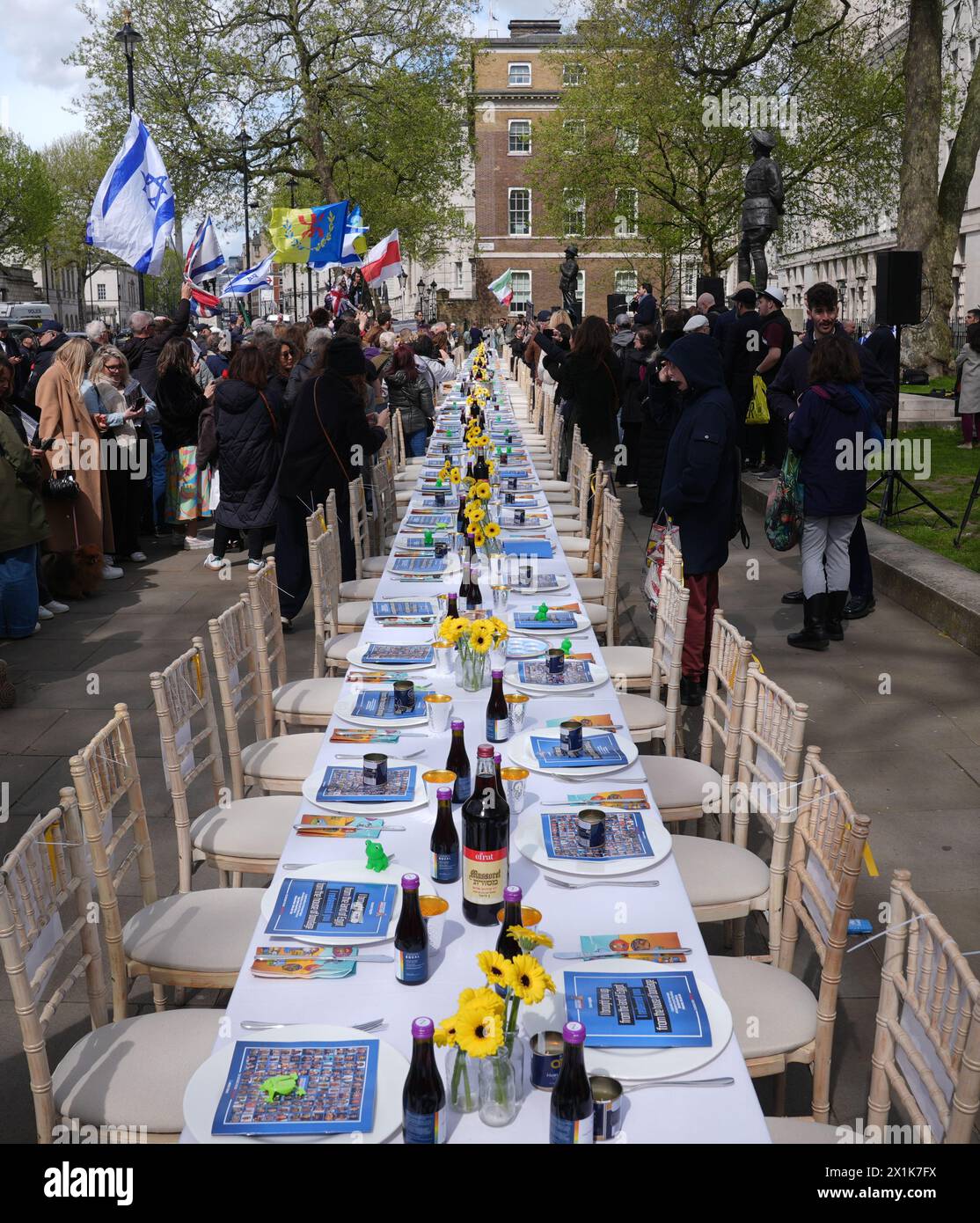 Places set on the Empty Seder Table installation, an empty dining table ...