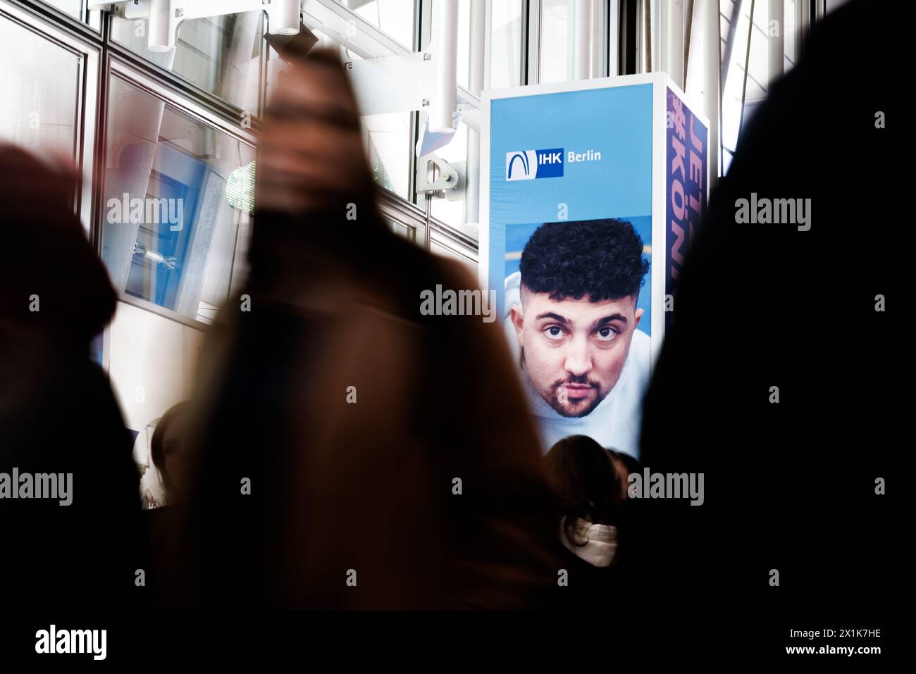 Berlin, Germany. 17th Apr, 2024. Visitors walk past stands with job ...