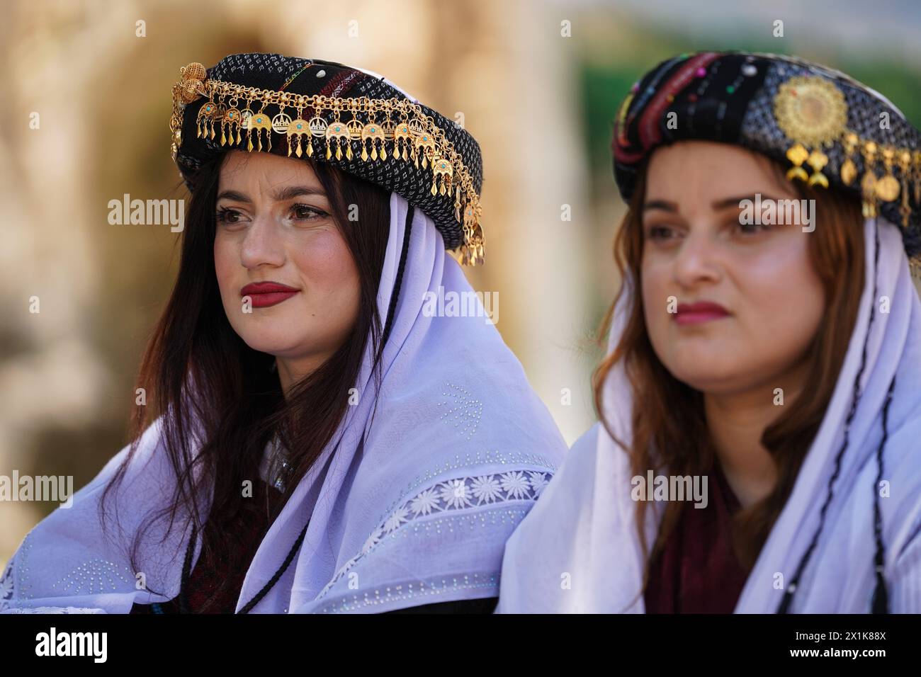 Two Iraqi Yazidi women gather at Lalish mountain valley and temple near ...