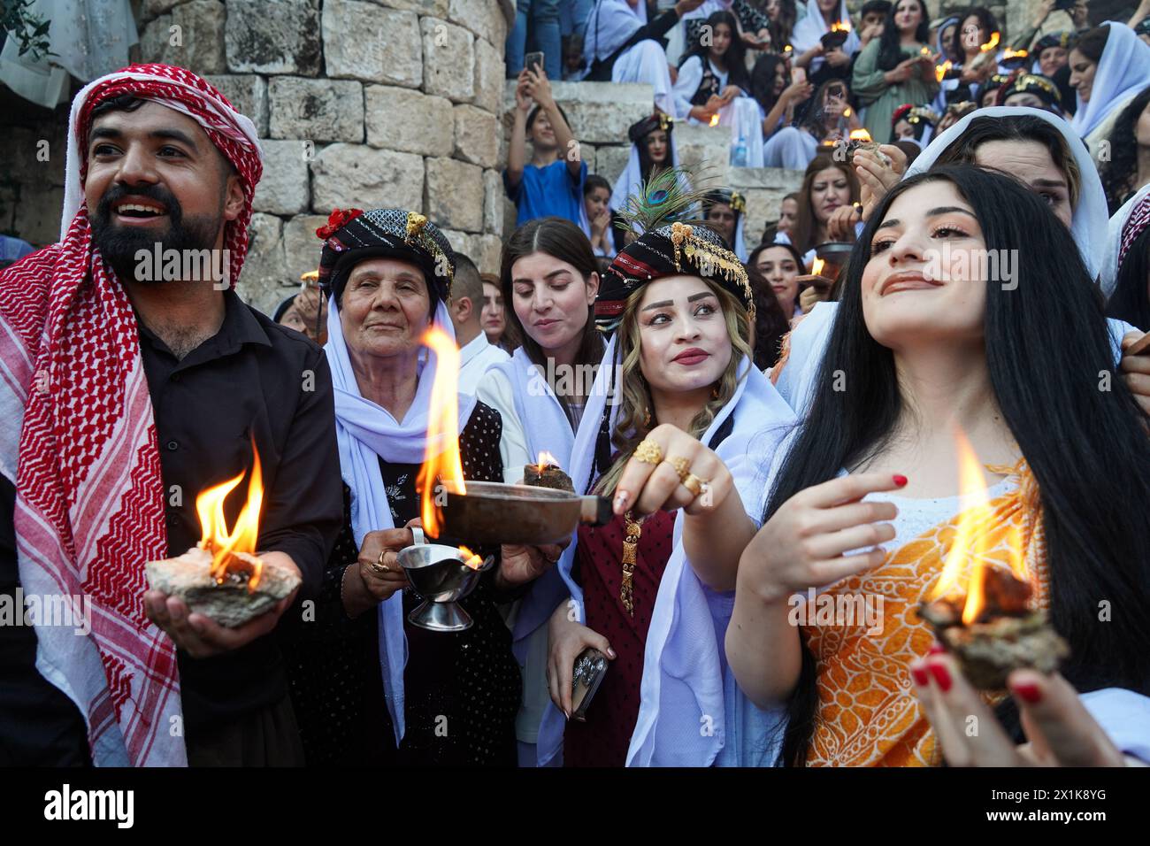 Iraqi Yazidis light candles at Lalish mountain valley and temple near ...