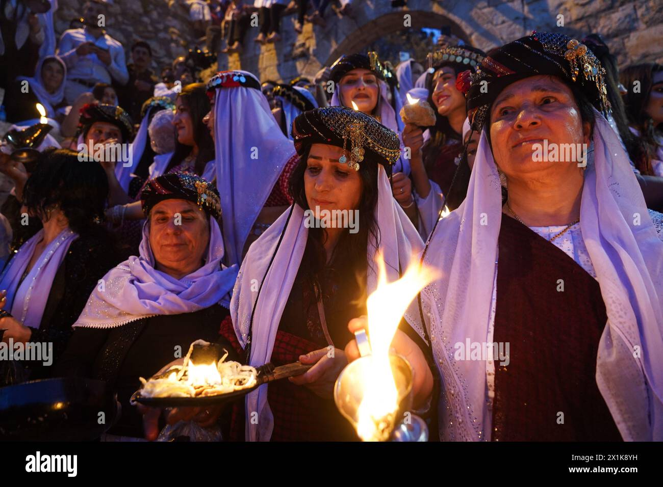 Iraqi Yazidi women light candles at Lalish mountain valley and temple ...